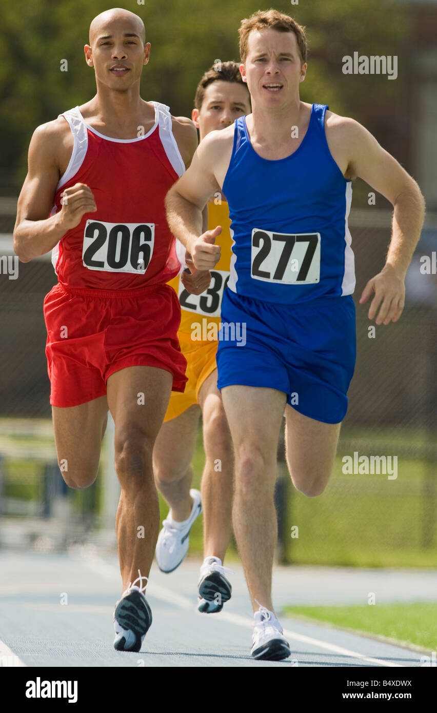Runners racing on track Stock Photo - Alamy