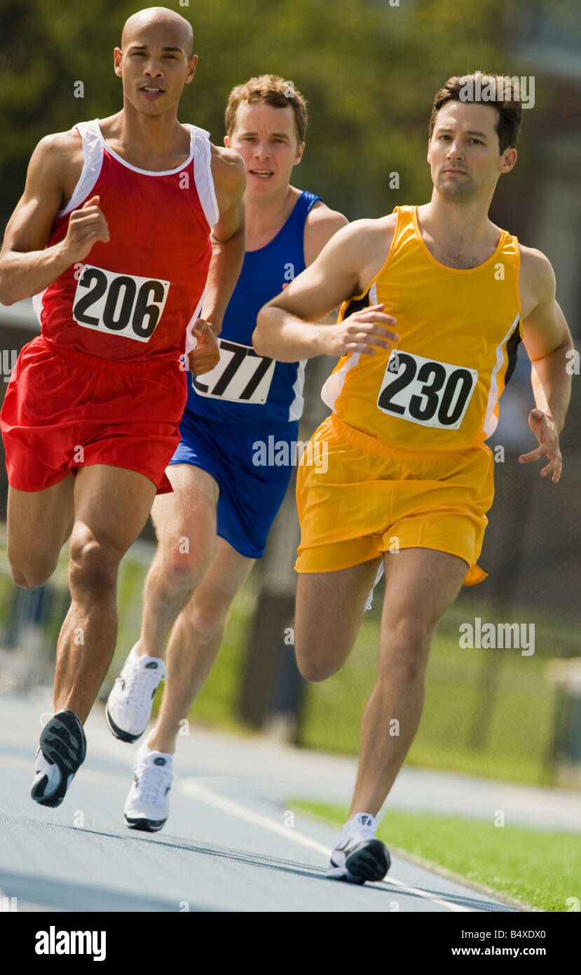 Runners racing on track Stock Photo - Alamy