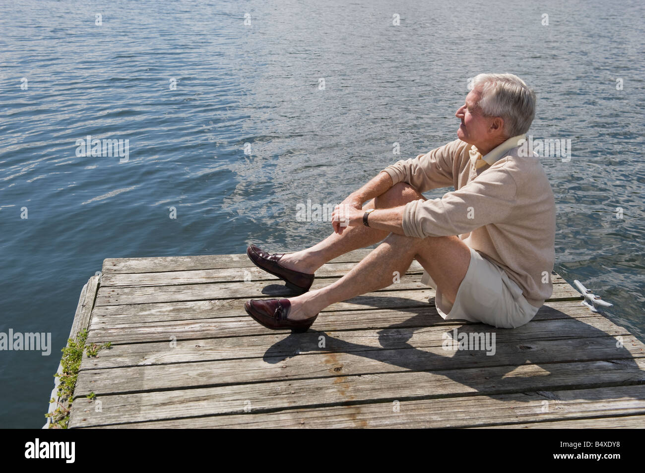 Man Sitting On Dock High Resolution Stock Photography and Images - Alamy