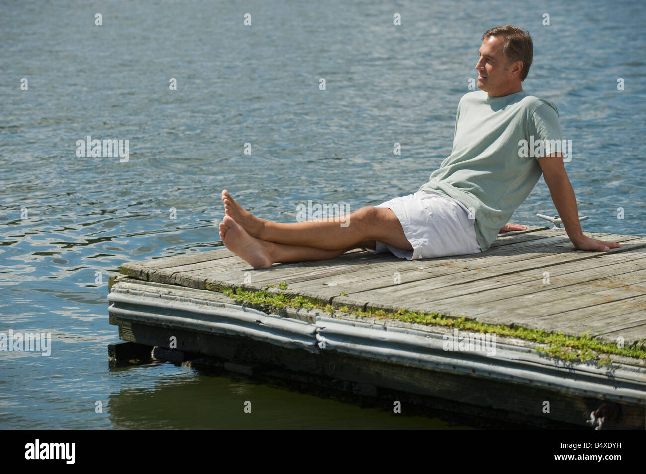Man Sitting On Dock High Resolution Stock Photography and Images - Alamy