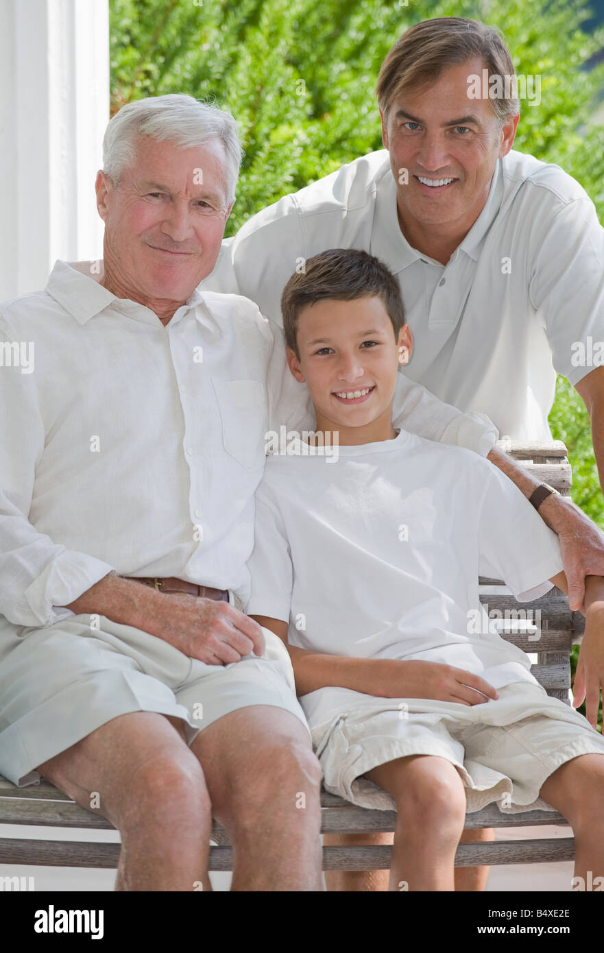Three generations of men posing on porch Stock Photo - Alamy