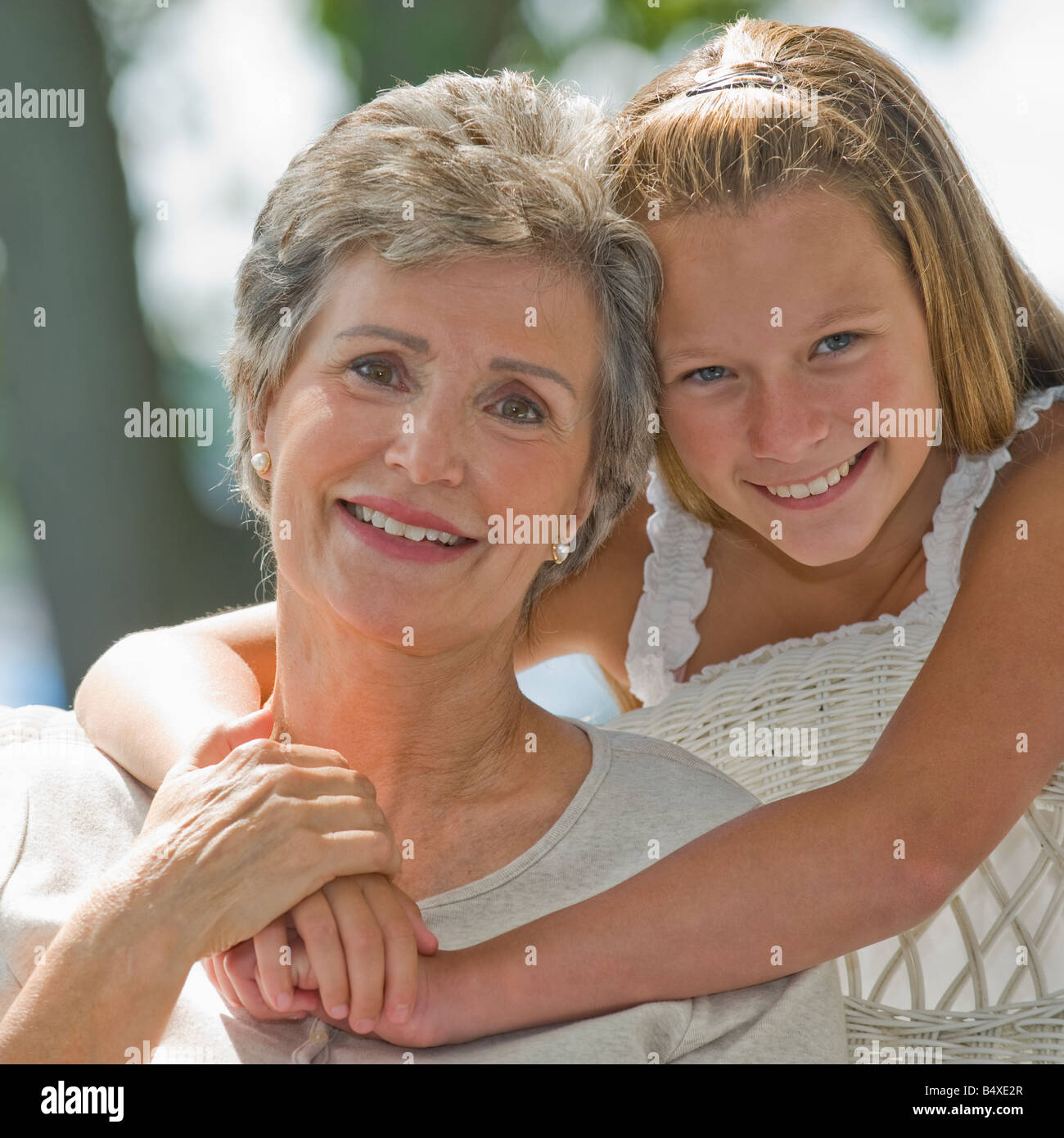Grandmother and granddaughter posing together Stock Photo - Alamy