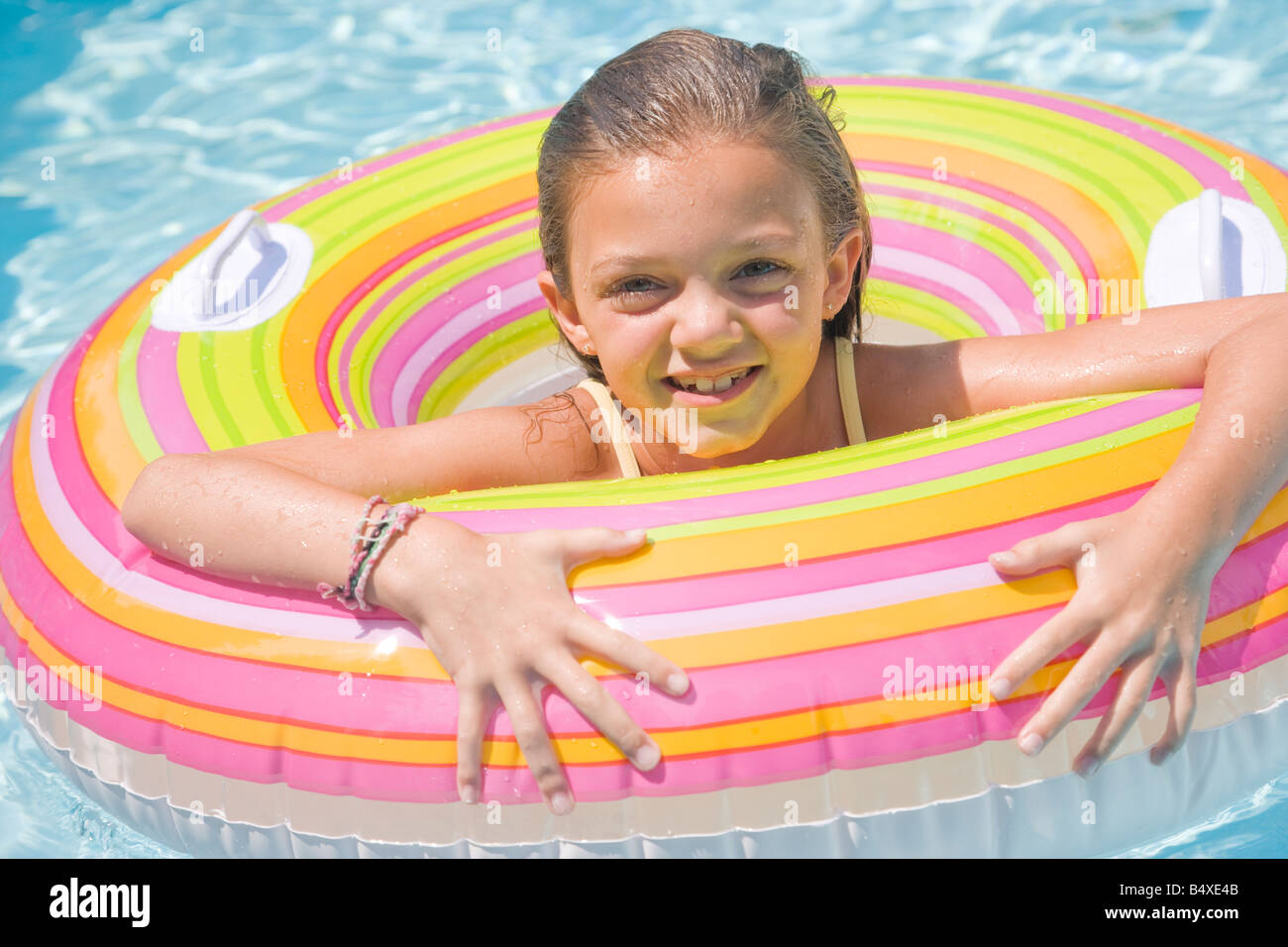 Girl playing in inflatable tube hi-res stock photography and images - Alamy