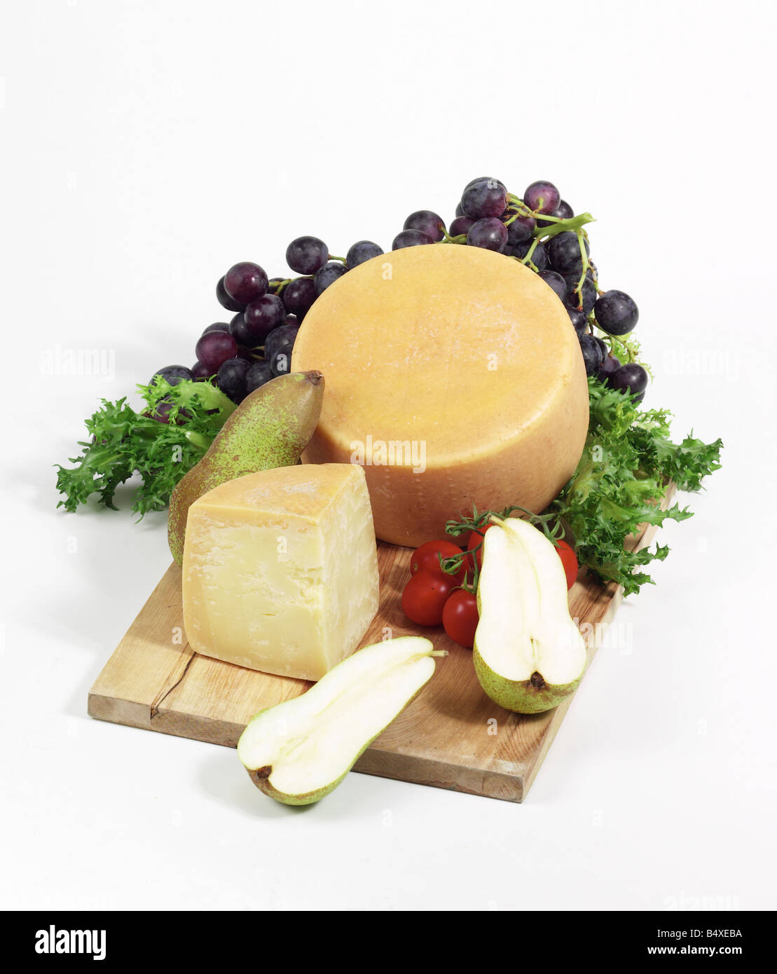 seasoned cheese on cutting board isolated on white Stock Photo - Alamy