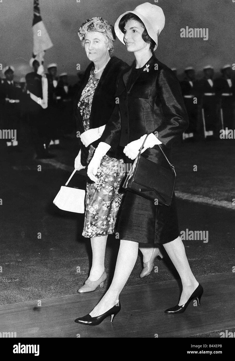 Jacqueline Onassis Kennedy walking across the tarmac with Mrs Dorothy ...