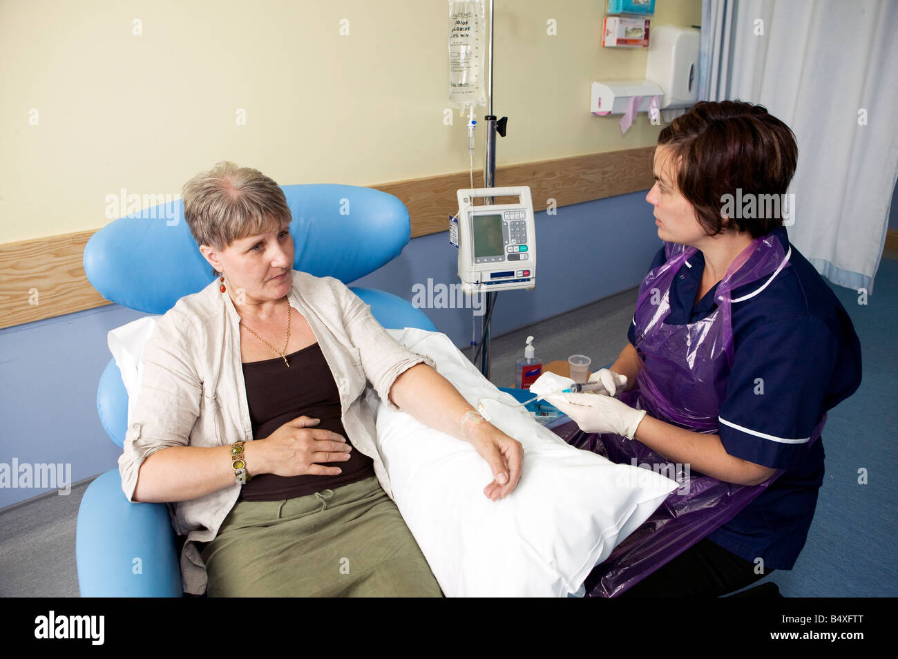 Nurse injecting anxious cancer patient with chemotherapy drug Stock ...