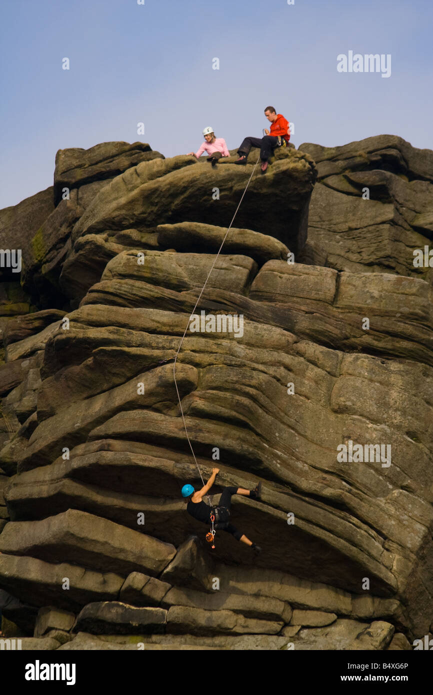 Climber on rock face overhang Stock Photo - Alamy