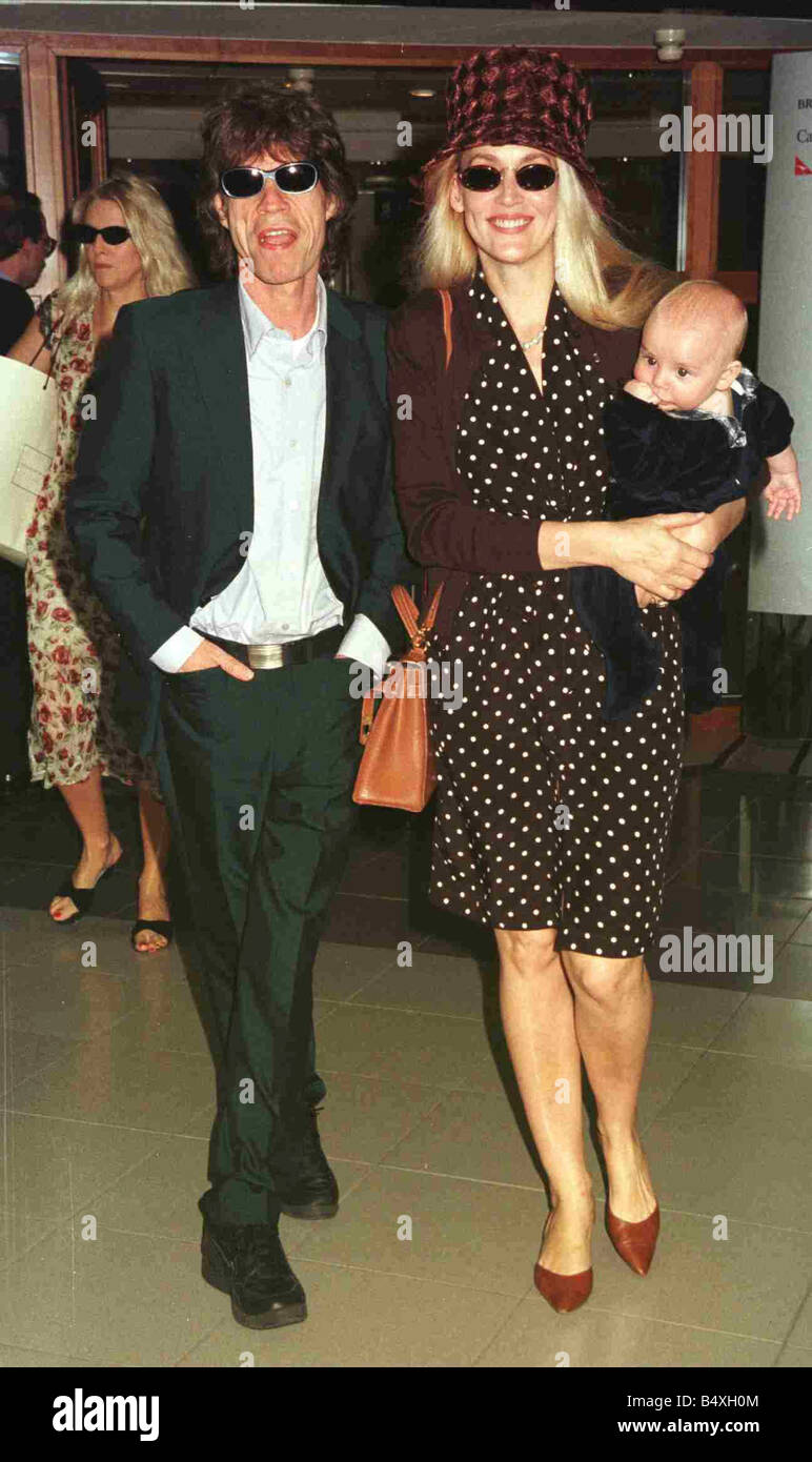Mick Jagger pop singer and wife Jerry with their new baby leave ...
