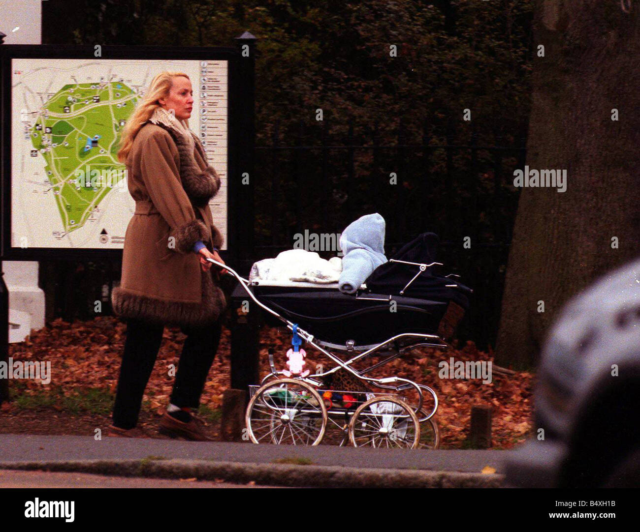 Jerry Hall in Richmond Park London in December 1998 pushing the pram of ...