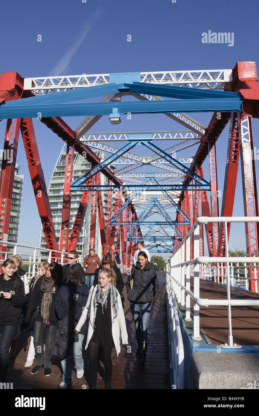 A Group of School Students cross the Detroit Bridge Salford Quays Stock ...