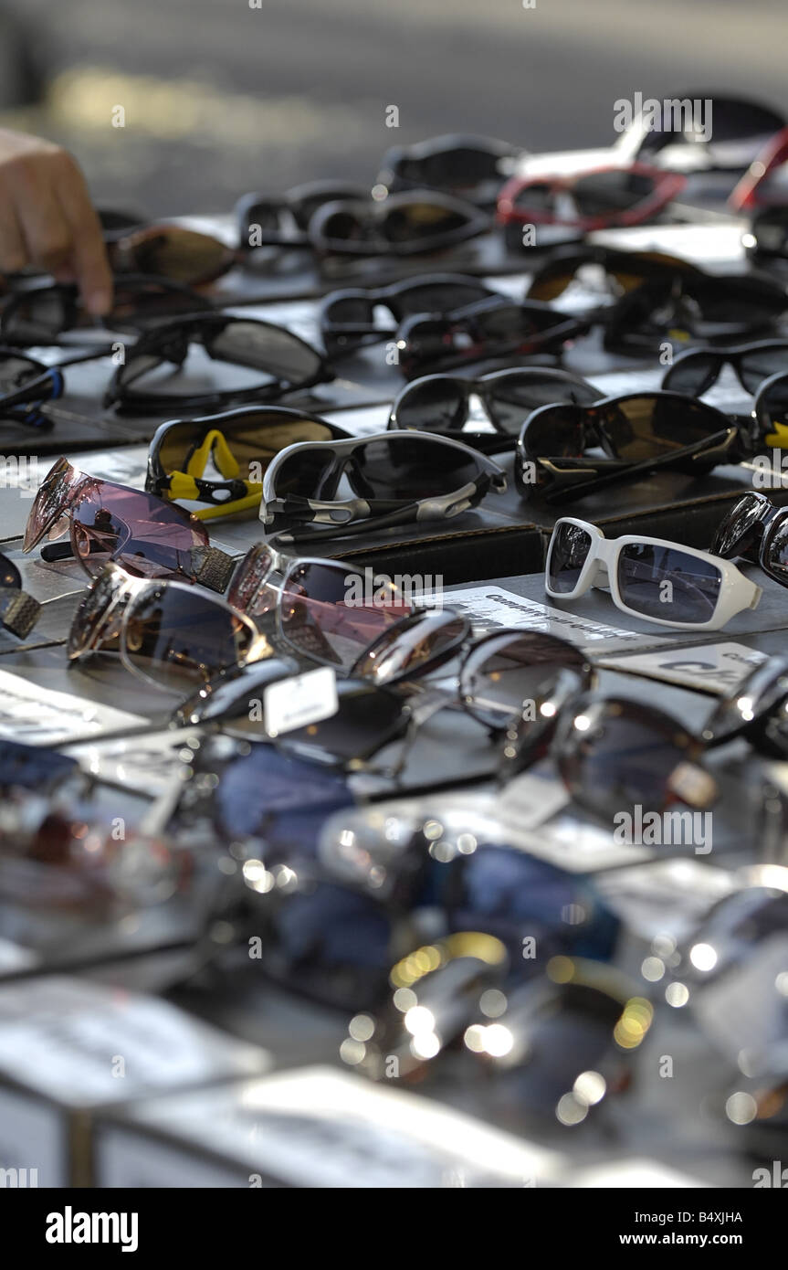 Sunglasses arranged on display for sale Stock Photo - Alamy