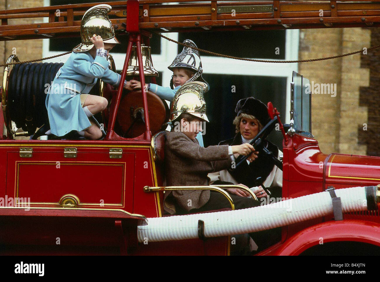 Peter Phillips January 1988 sitting at wheel of old fashioned fire ...
