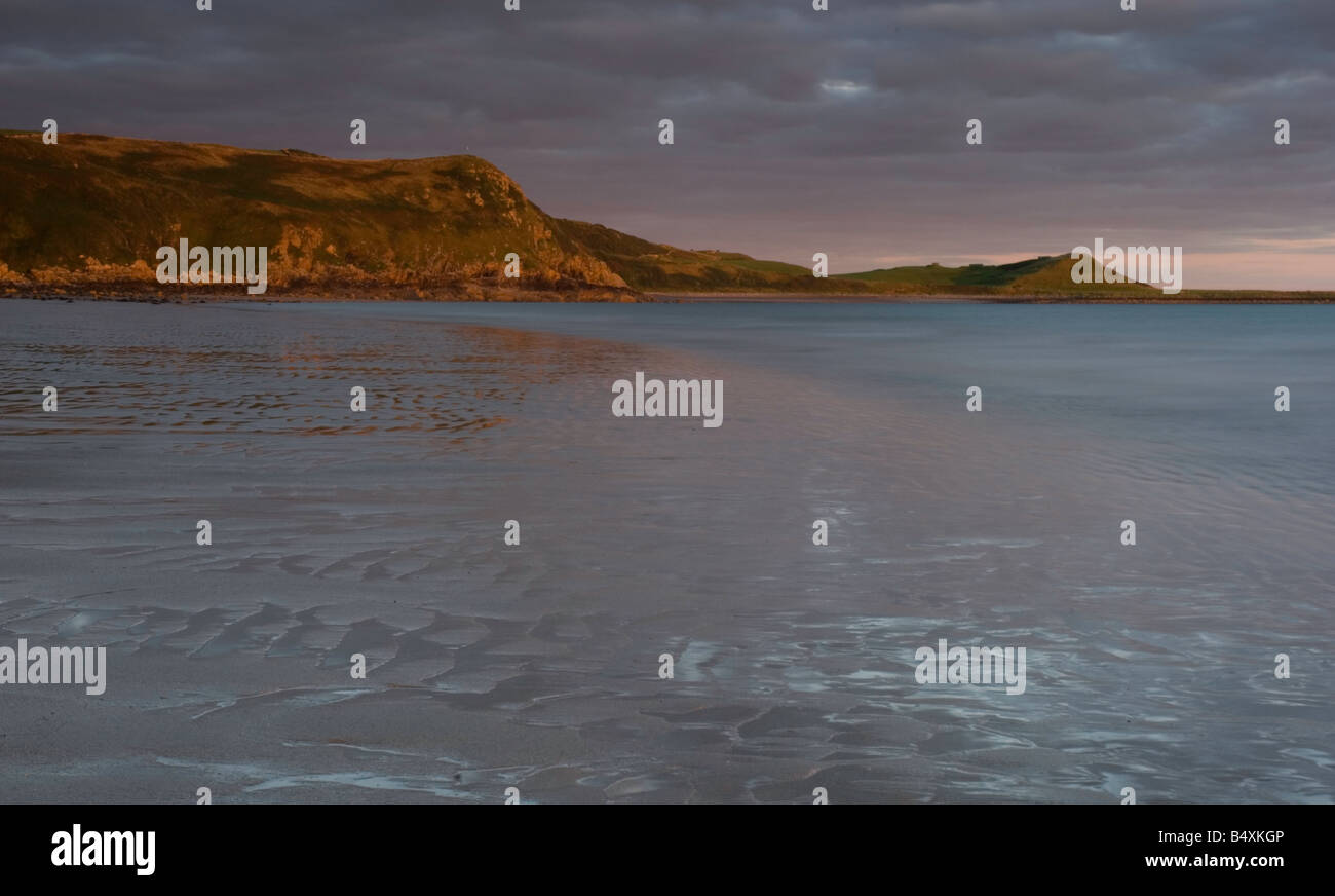 Sun setting over Galloway Beach Stock Photo - Alamy