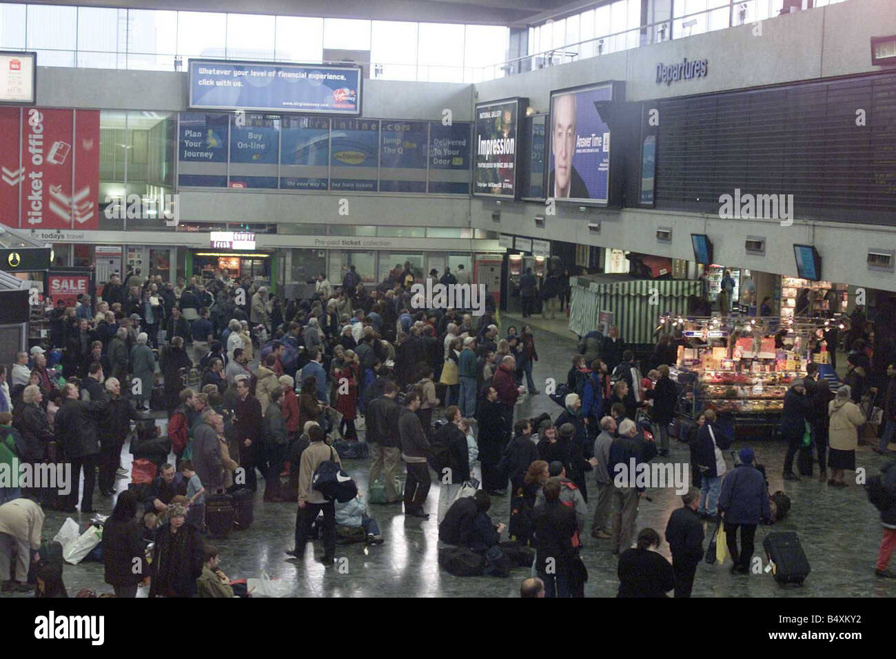 Hundreds of people queue at Euston Station December 2000 waiting for ...