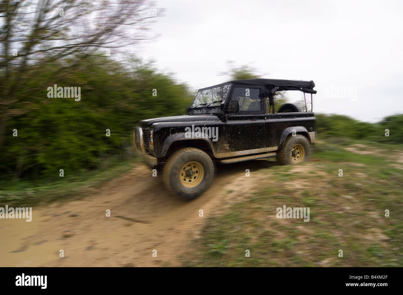 Land Rover defender driving off road Stock Photo - Alamy