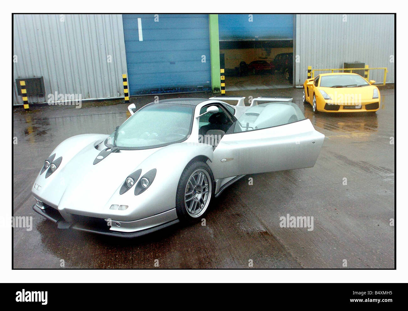 Silver Pagani Zonda and a yellow Lamborghini Gallardo Stock Photo - Alamy