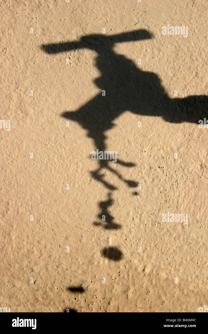 Shadow of a tap dripping water Stock Photo - Alamy