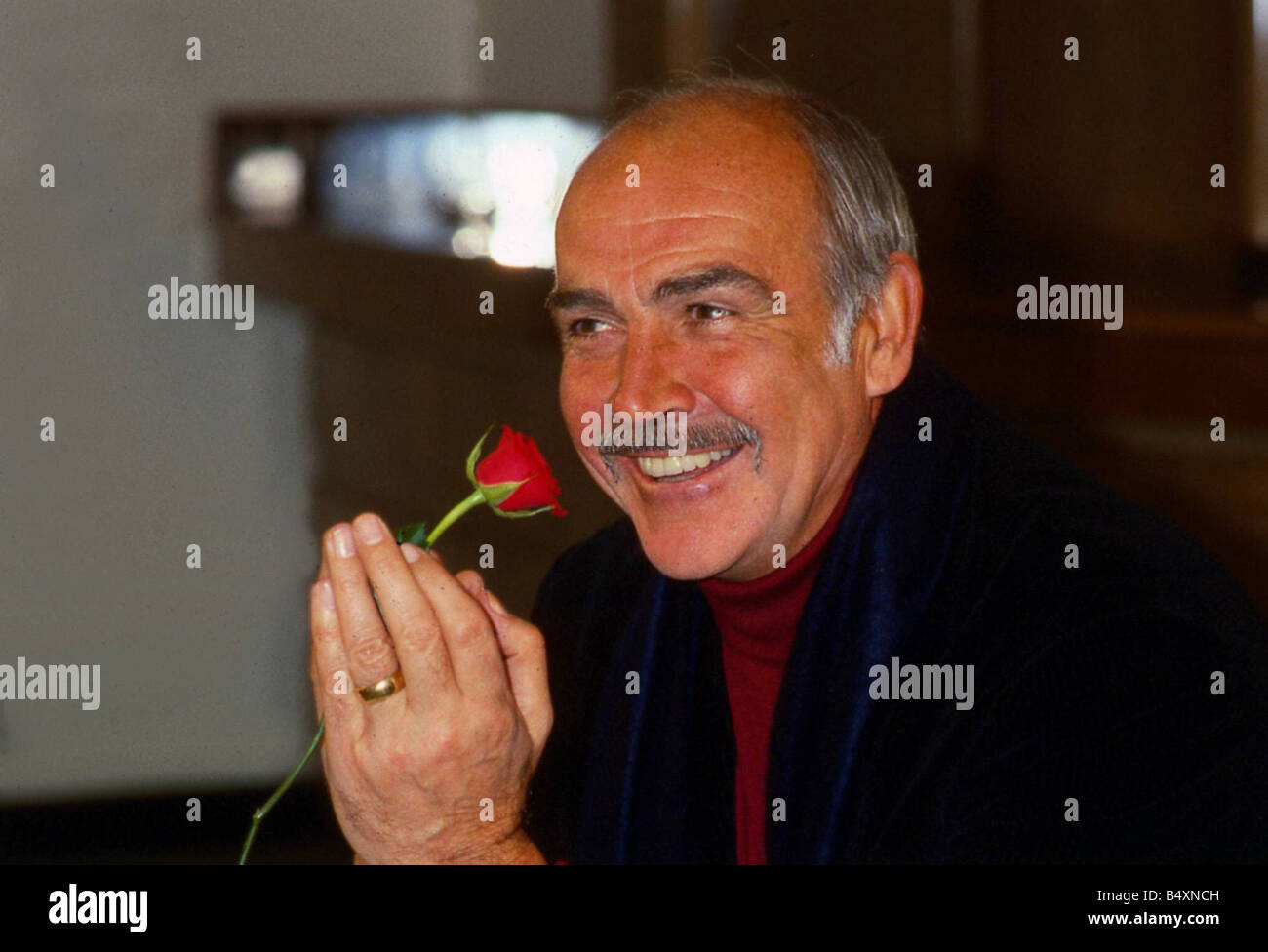 Sean Connery holding rose January 1990 Stock Photo - Alamy