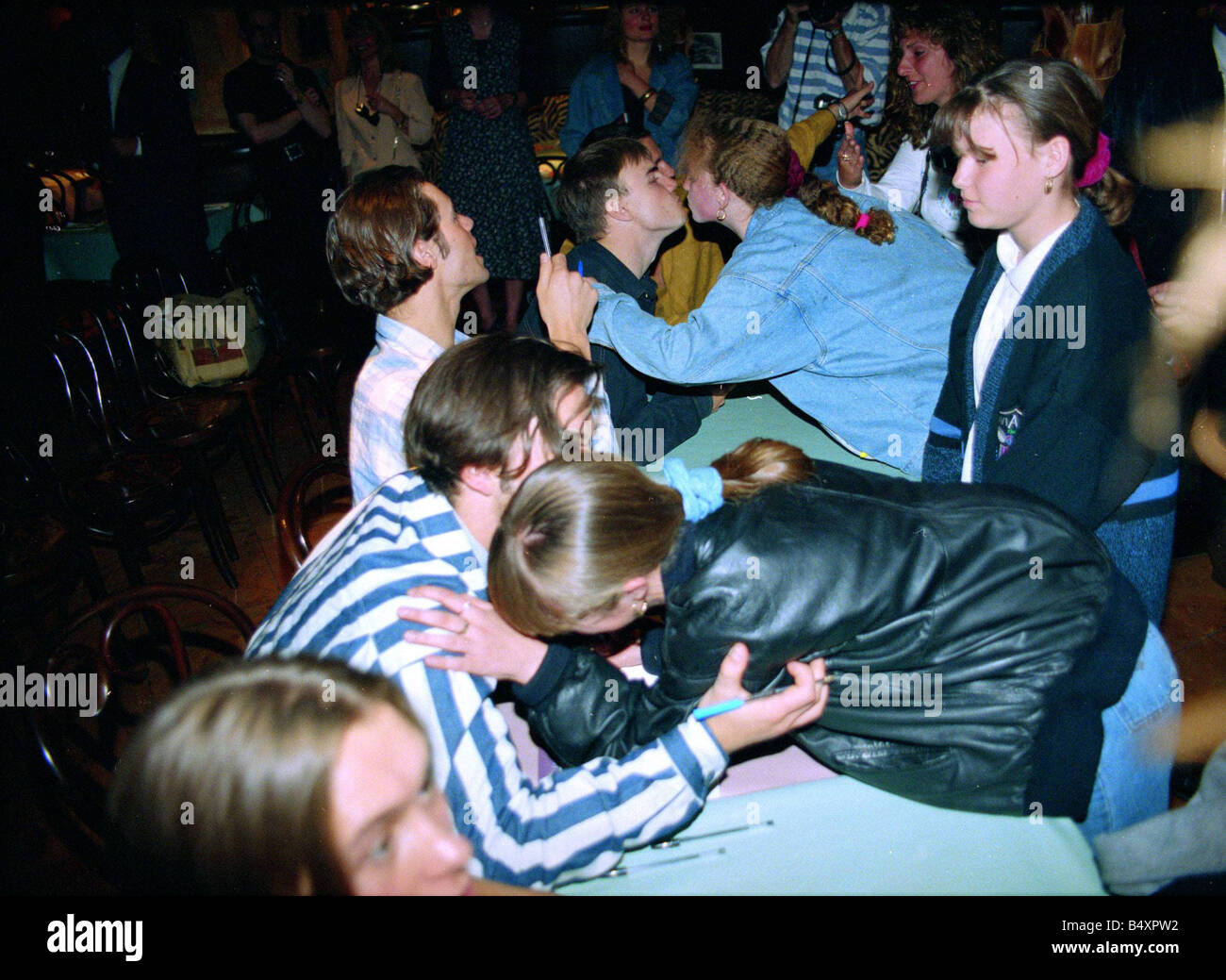 Pop group Take That sign autographs and pose for pictures for girl fans ...