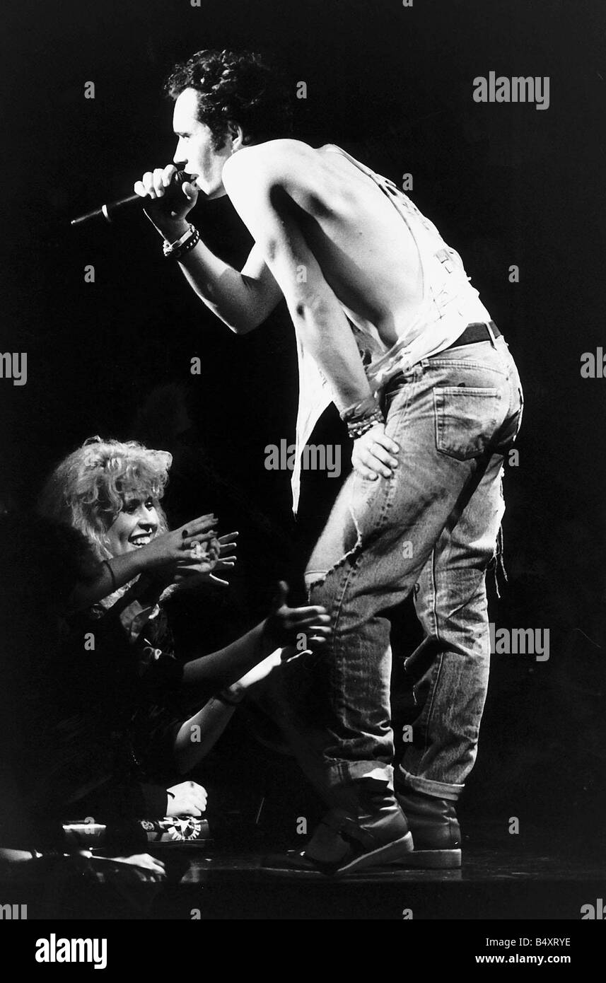 Adam Ant pop singer on stage ripped t shirt Stock Photo - Alamy