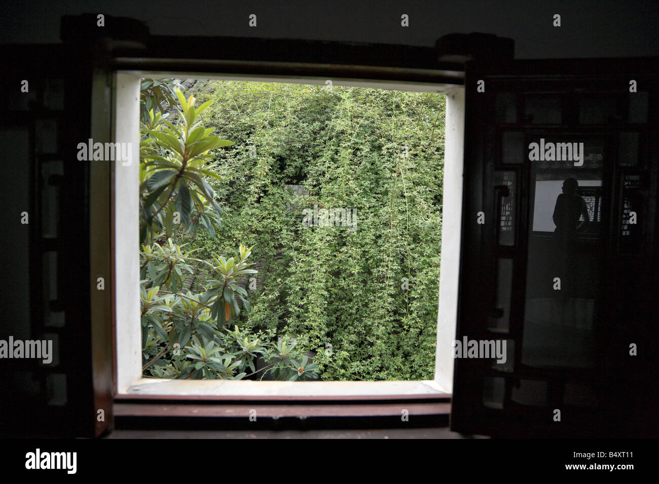 Garden window and mysterious human figure, Nanjing, China. The Gan ...