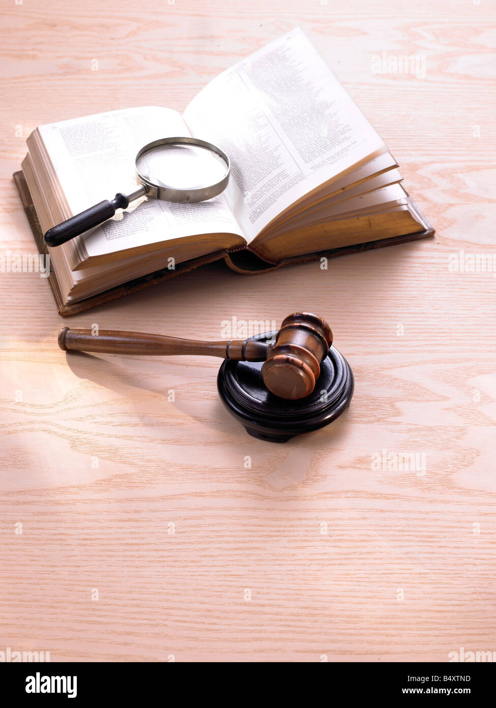 gavel, law book,magnifying glass Stock Photo - Alamy