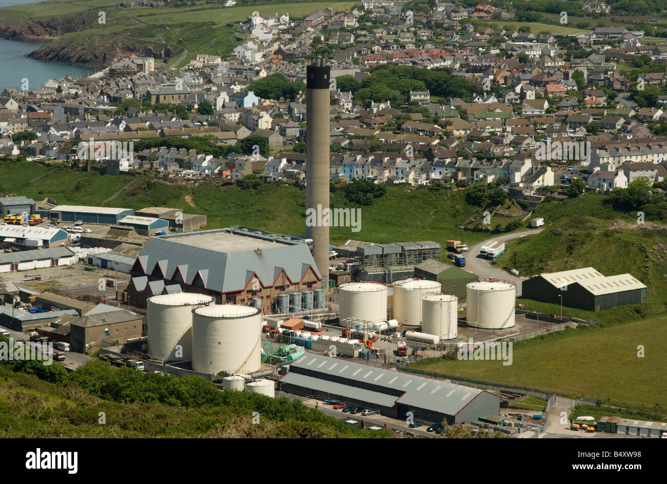 Peel town viewed from hills above including oil tanks and industrial ...