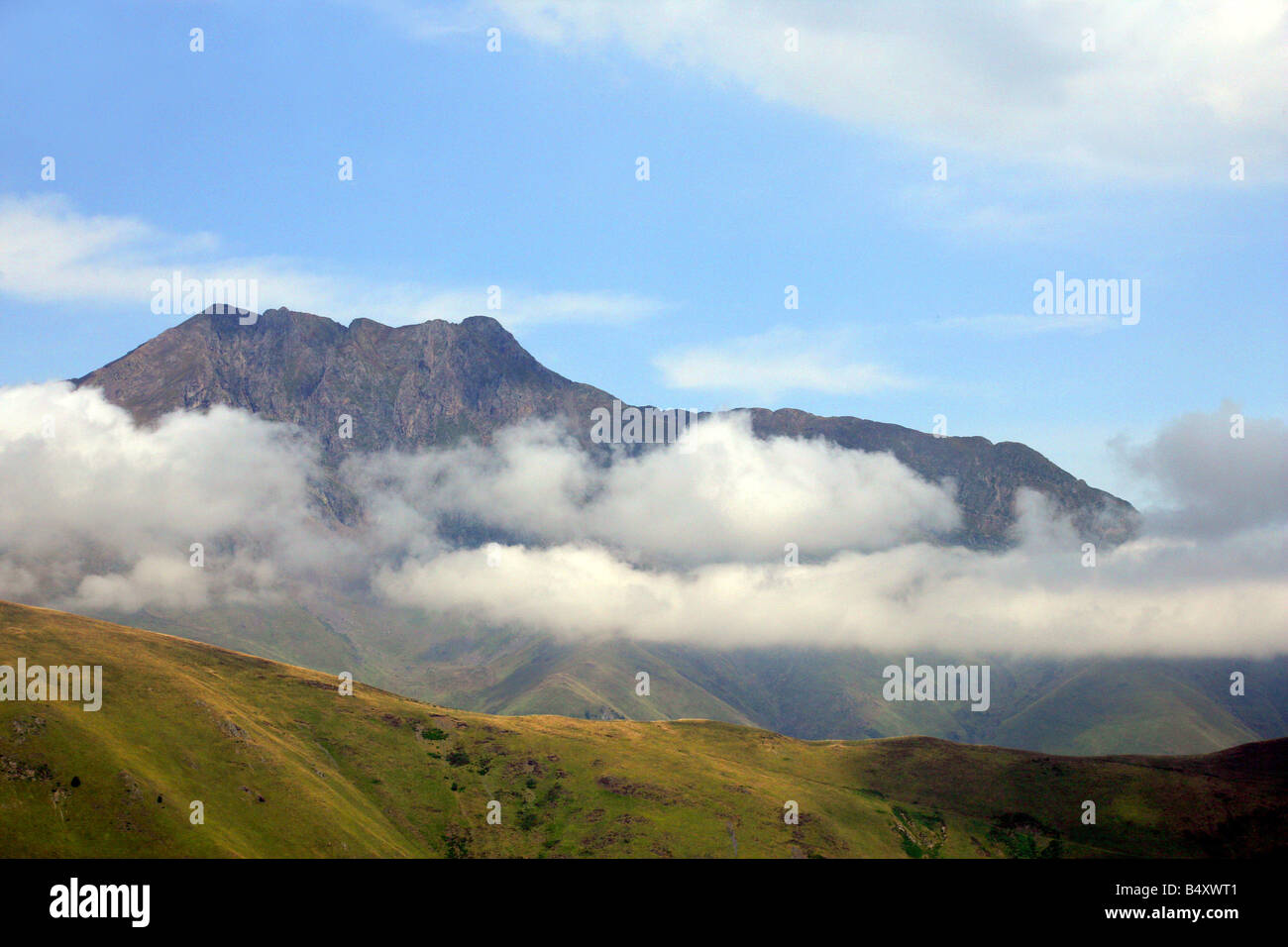 Smoke over landscape with mountain in background Stock Photo - Alamy