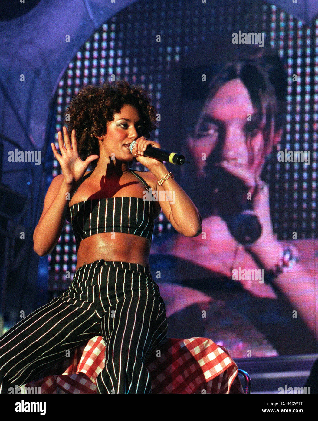 Spice Girls Mel B singing on stage during their concert at Glasgow SECC April 1998 Stock Photo ...