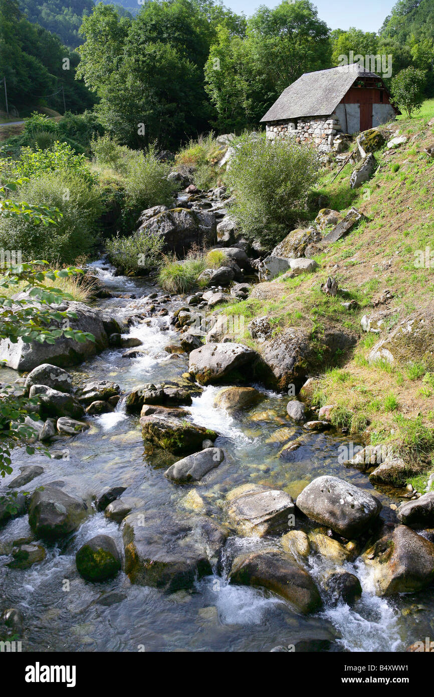 Water stream flowing through rocks Stock Photo - Alamy