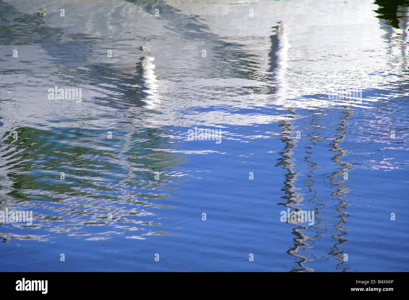 Reflection of building on pond Stock Photo - Alamy