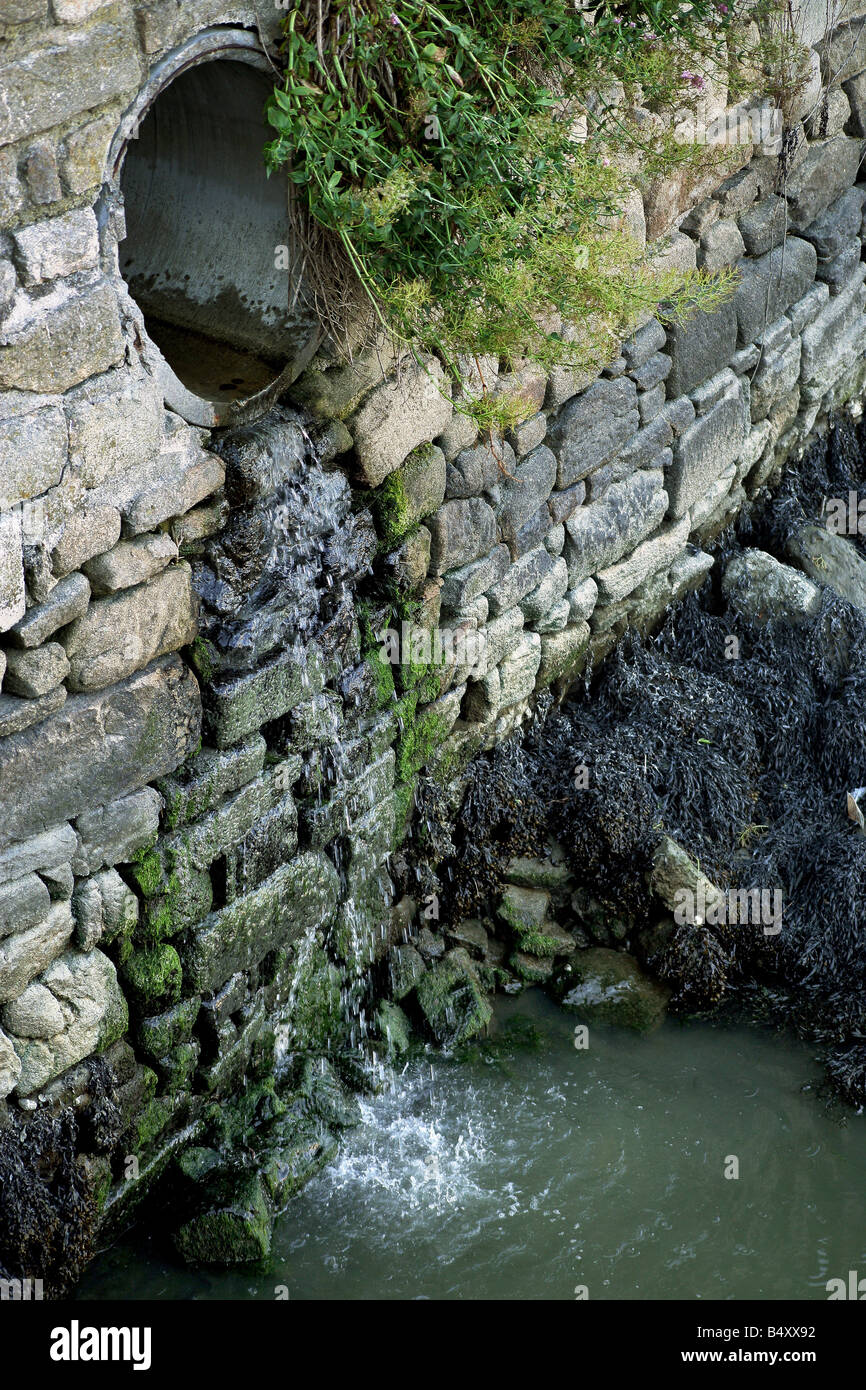 Water flowing through drainage pipe Stock Photo - Alamy