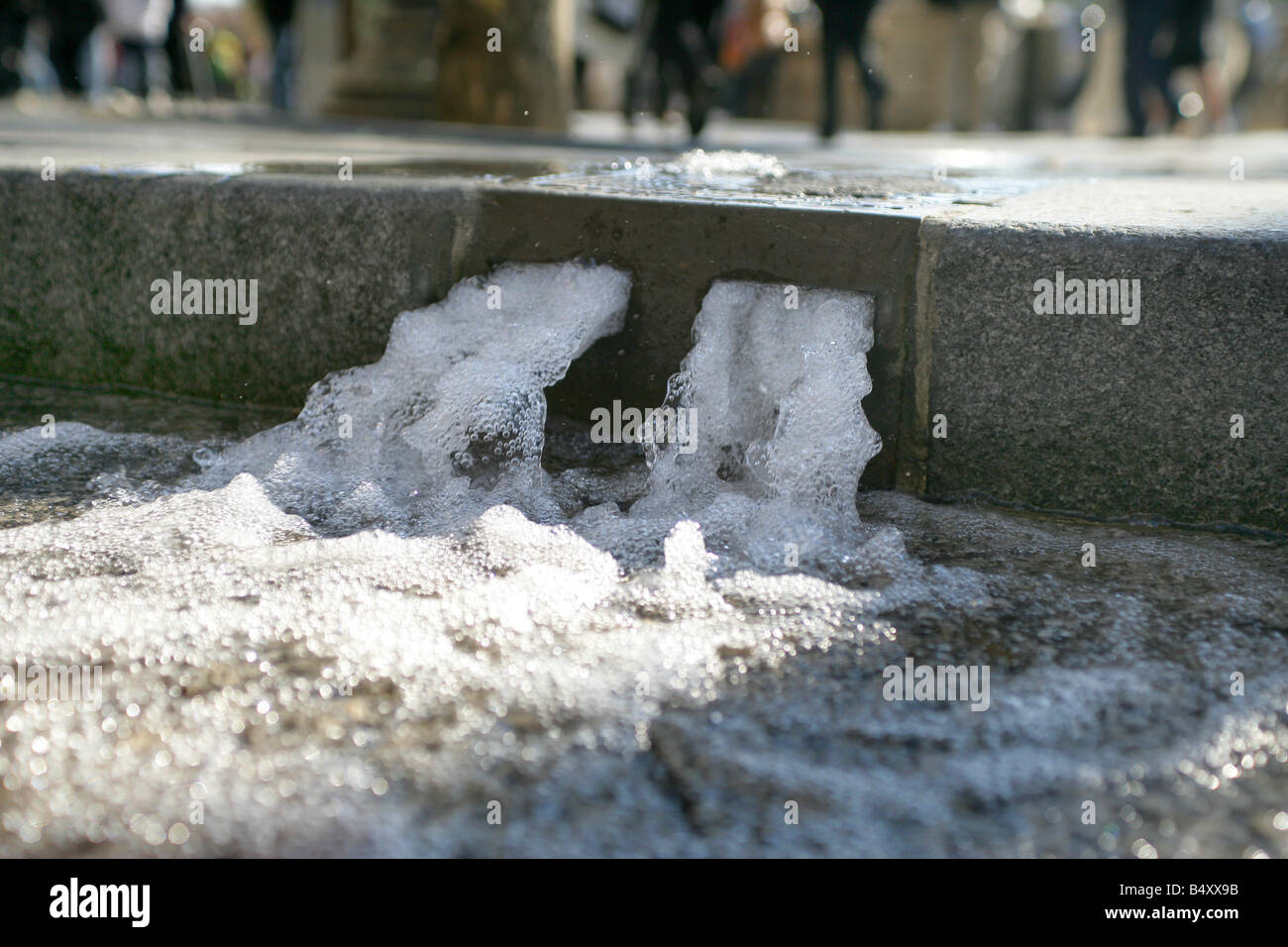 Water flowing through drain Stock Photo - Alamy