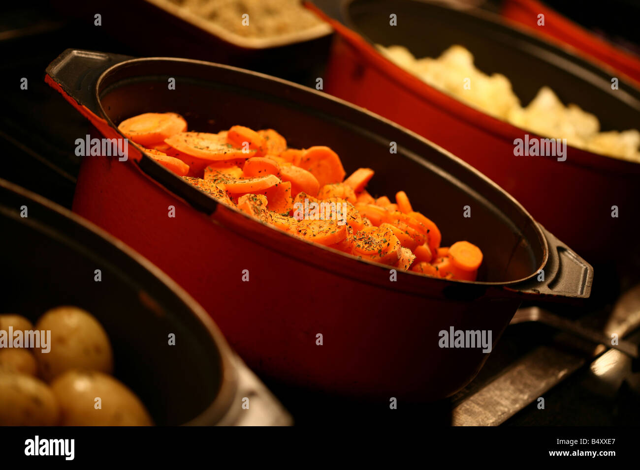 Carrots at a traditional carvery pub Stock Photo - Alamy