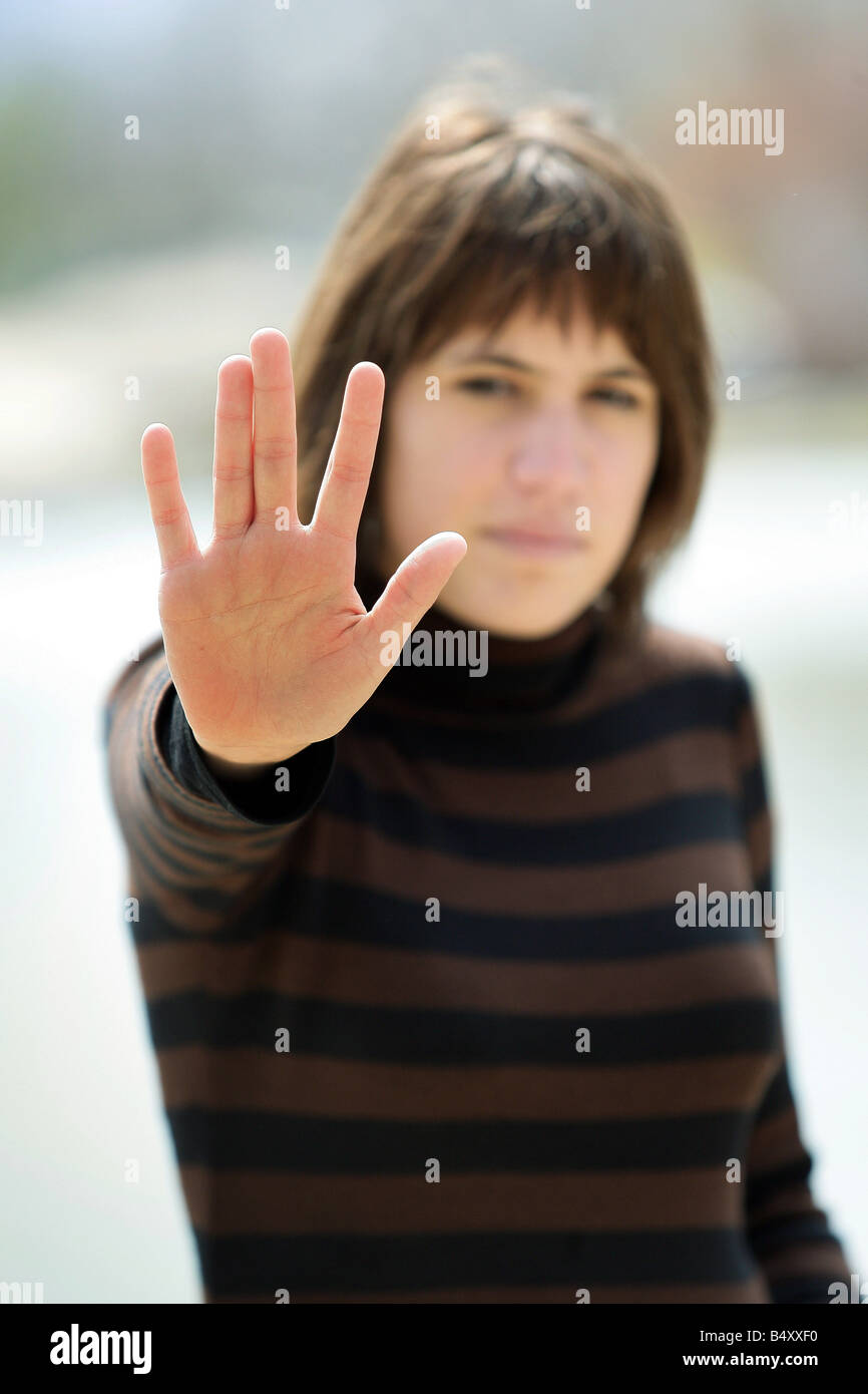 Young woman showing her hand, portrait Stock Photo - Alamy