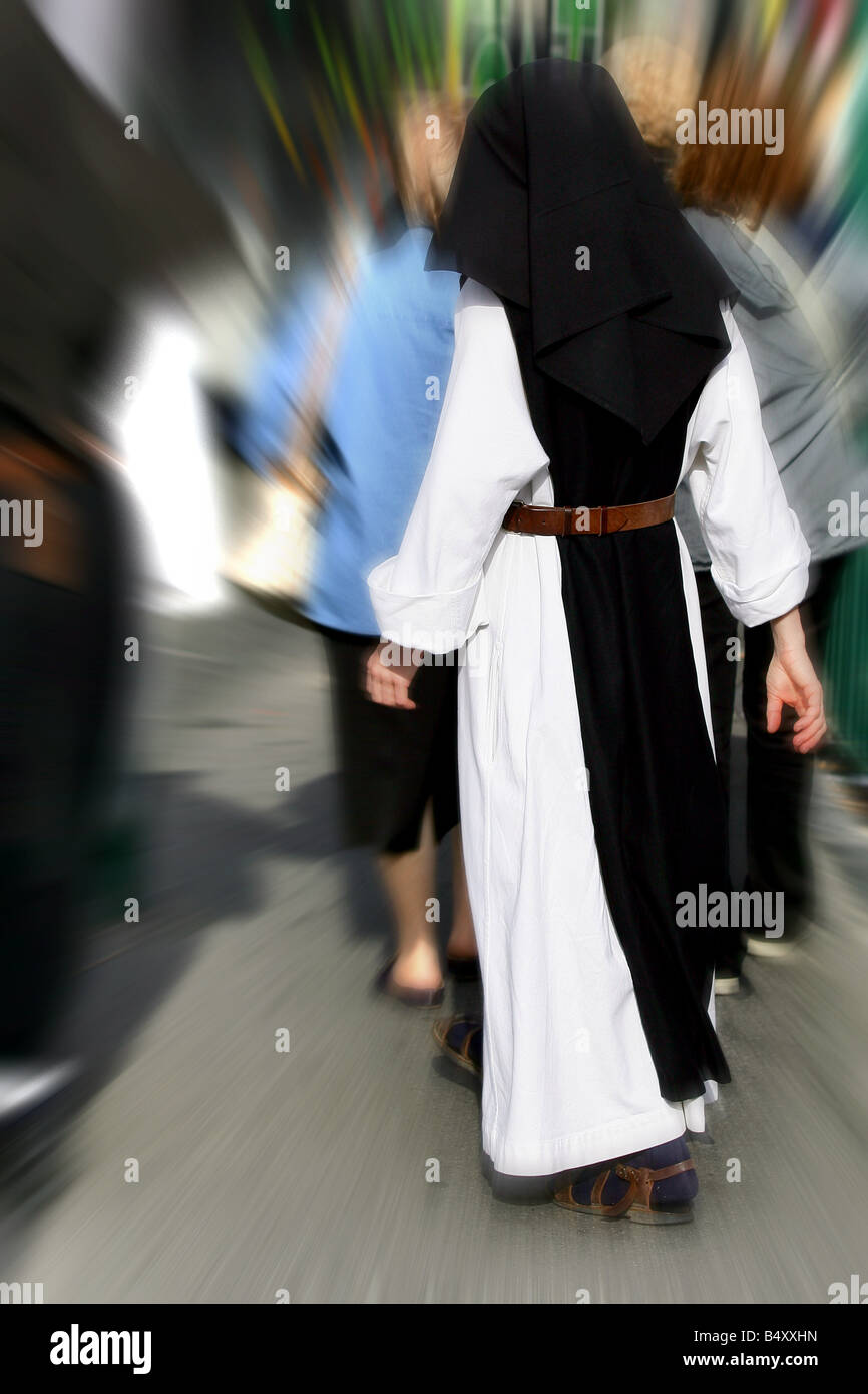 Nun walking, rear view Stock Photo - Alamy