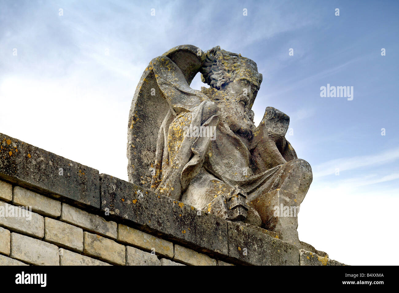 Statue on wall Stock Photo - Alamy