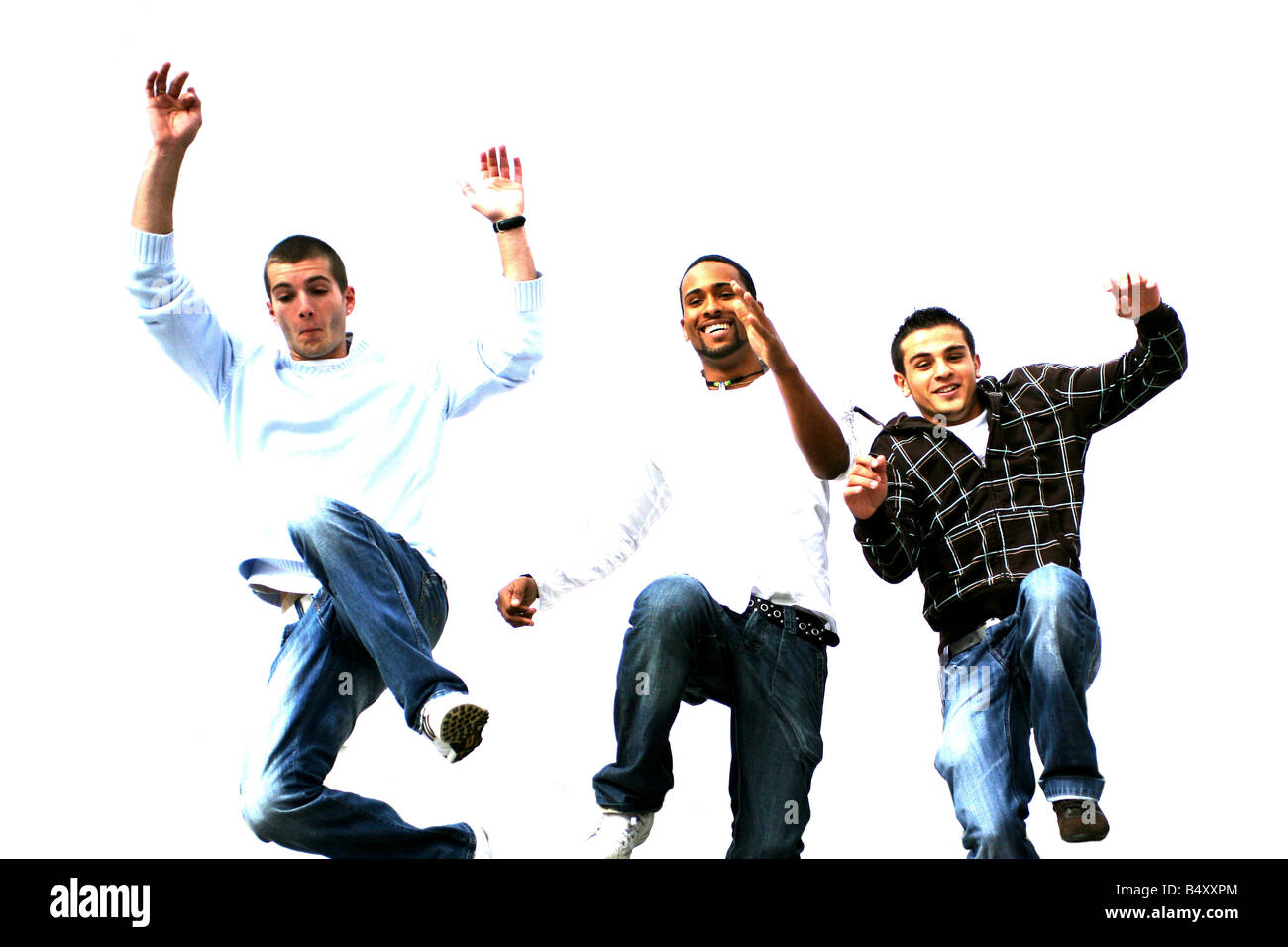 Group of friends jumping Stock Photo - Alamy