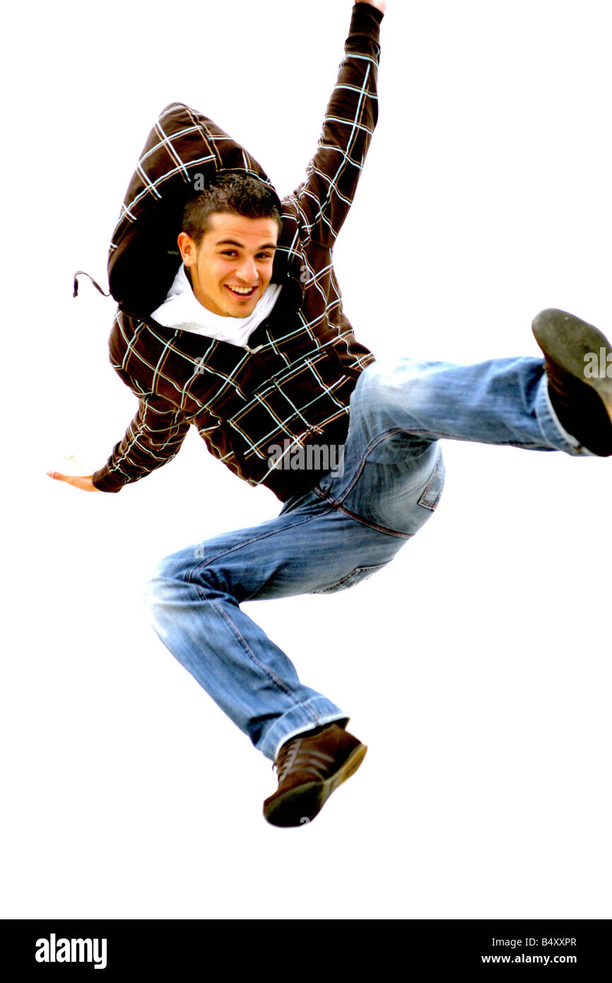 Young man jumping, smiling, portrait Stock Photo - Alamy