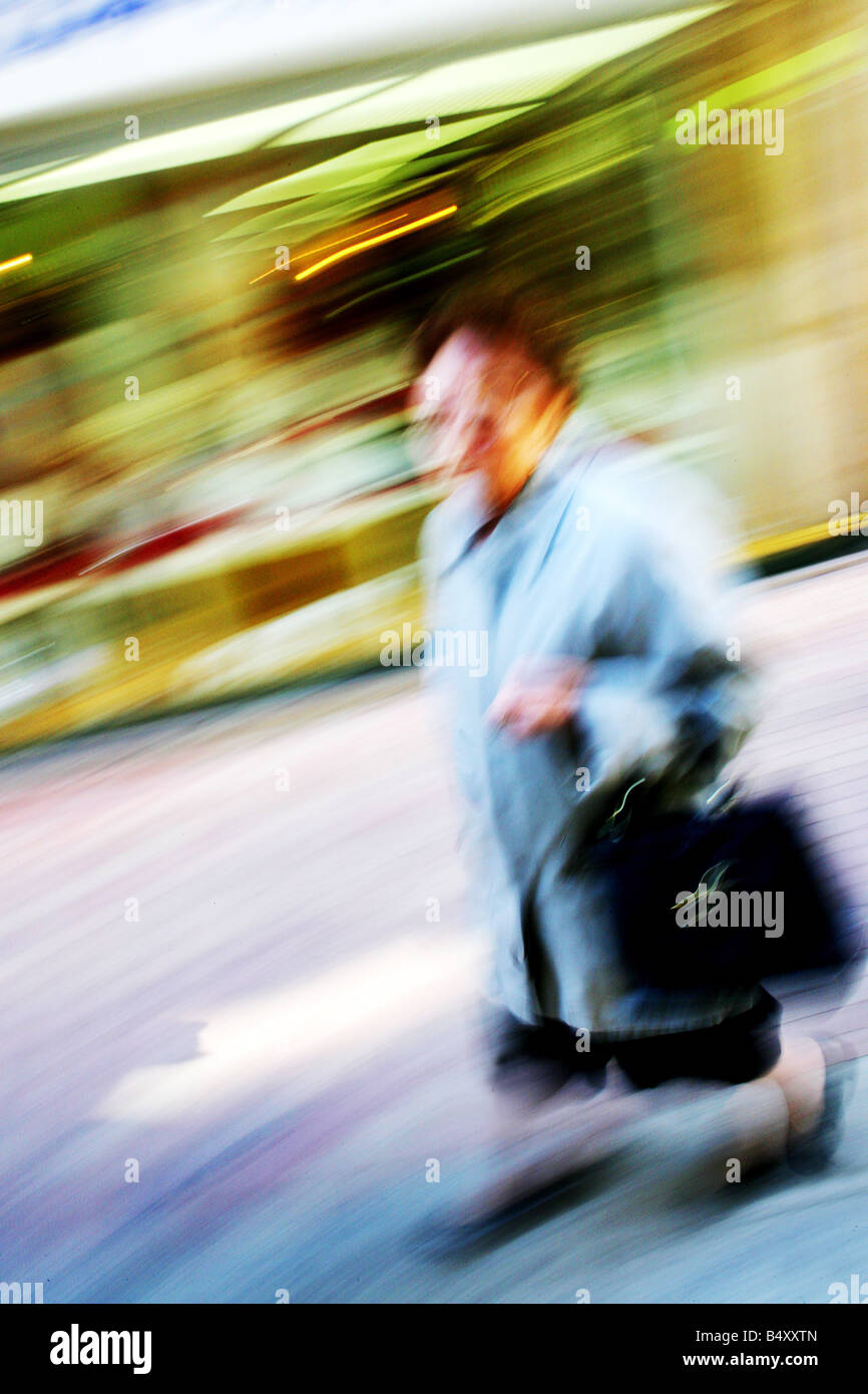 Person walking with bag Stock Photo - Alamy