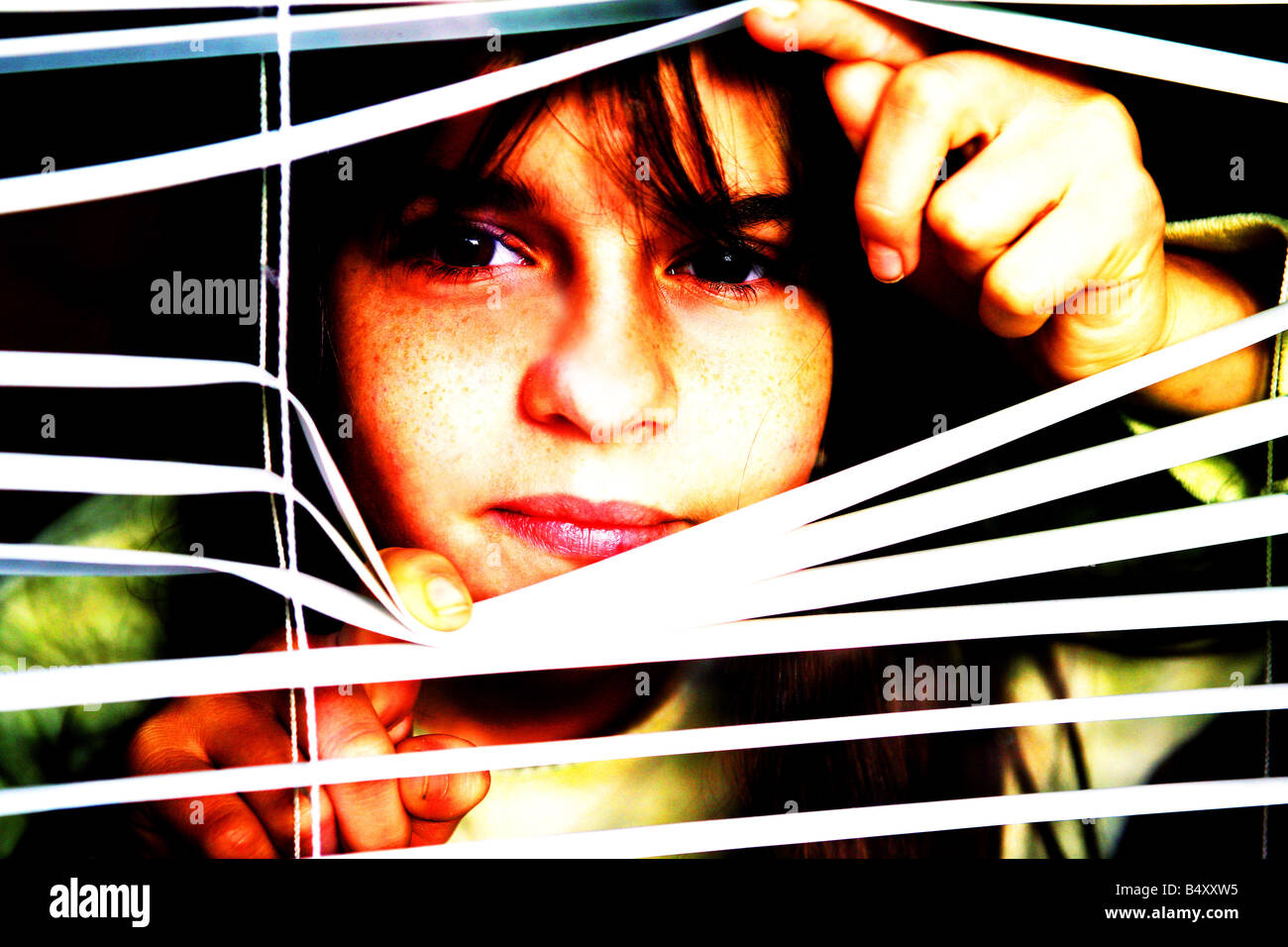 Girl looking through window Stock Photo - Alamy