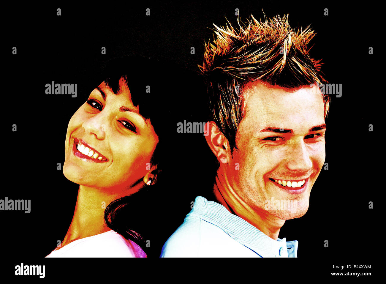 Young couple back to back, smiling Stock Photo - Alamy