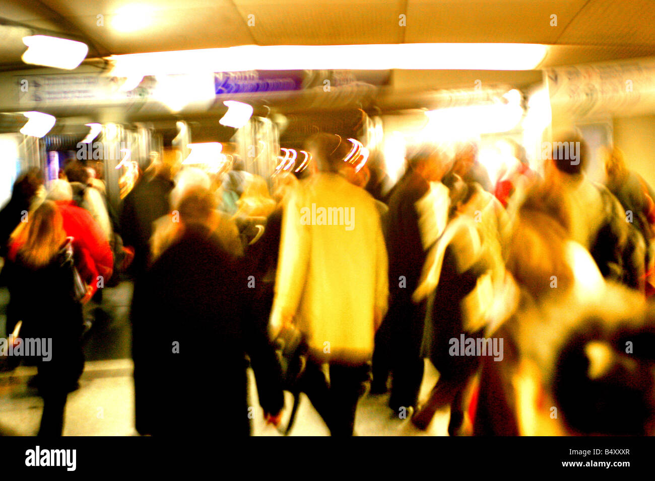 Commuters walking in subway Stock Photo - Alamy