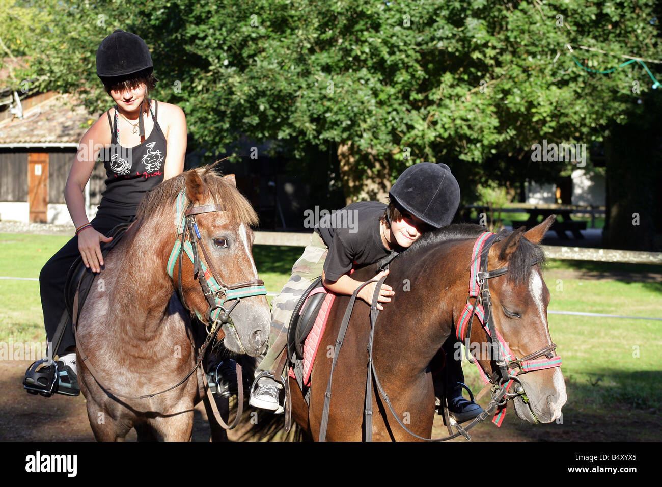 Boys riding horses Stock Photo - Alamy
