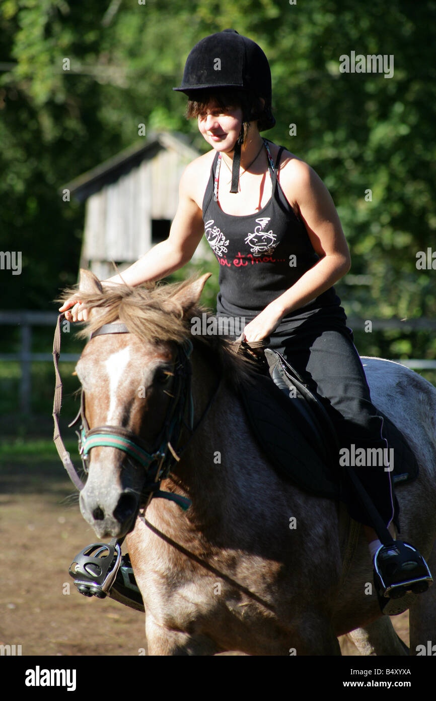 Boy riding horse Stock Photo - Alamy