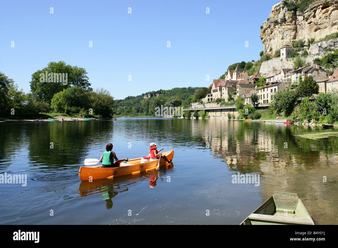 Women in a rowboat in river, rear view Stock Photo - Alamy