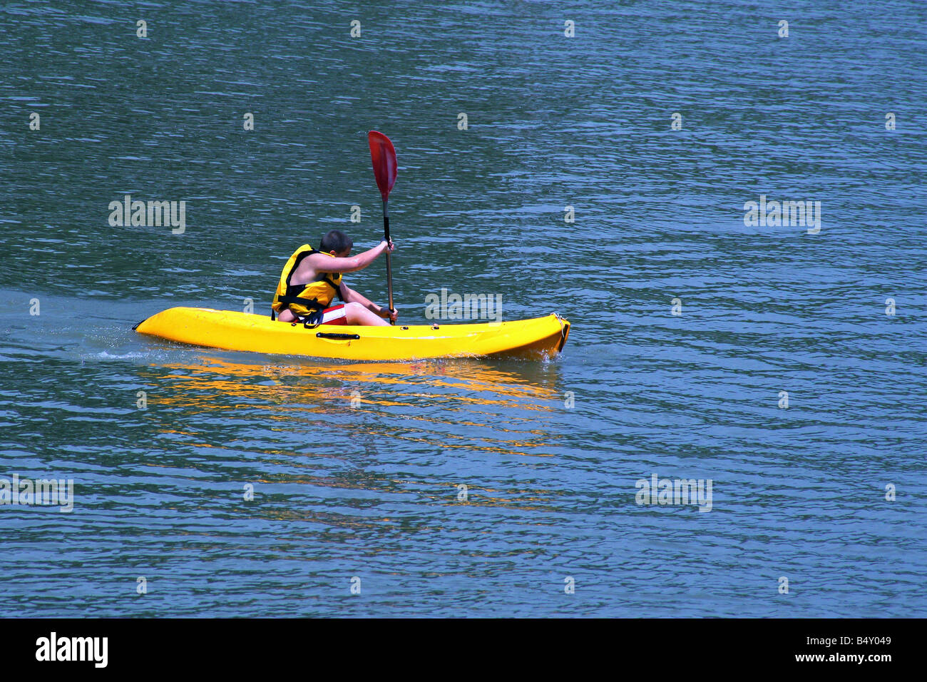 Man kayaking in sea Stock Photo - Alamy