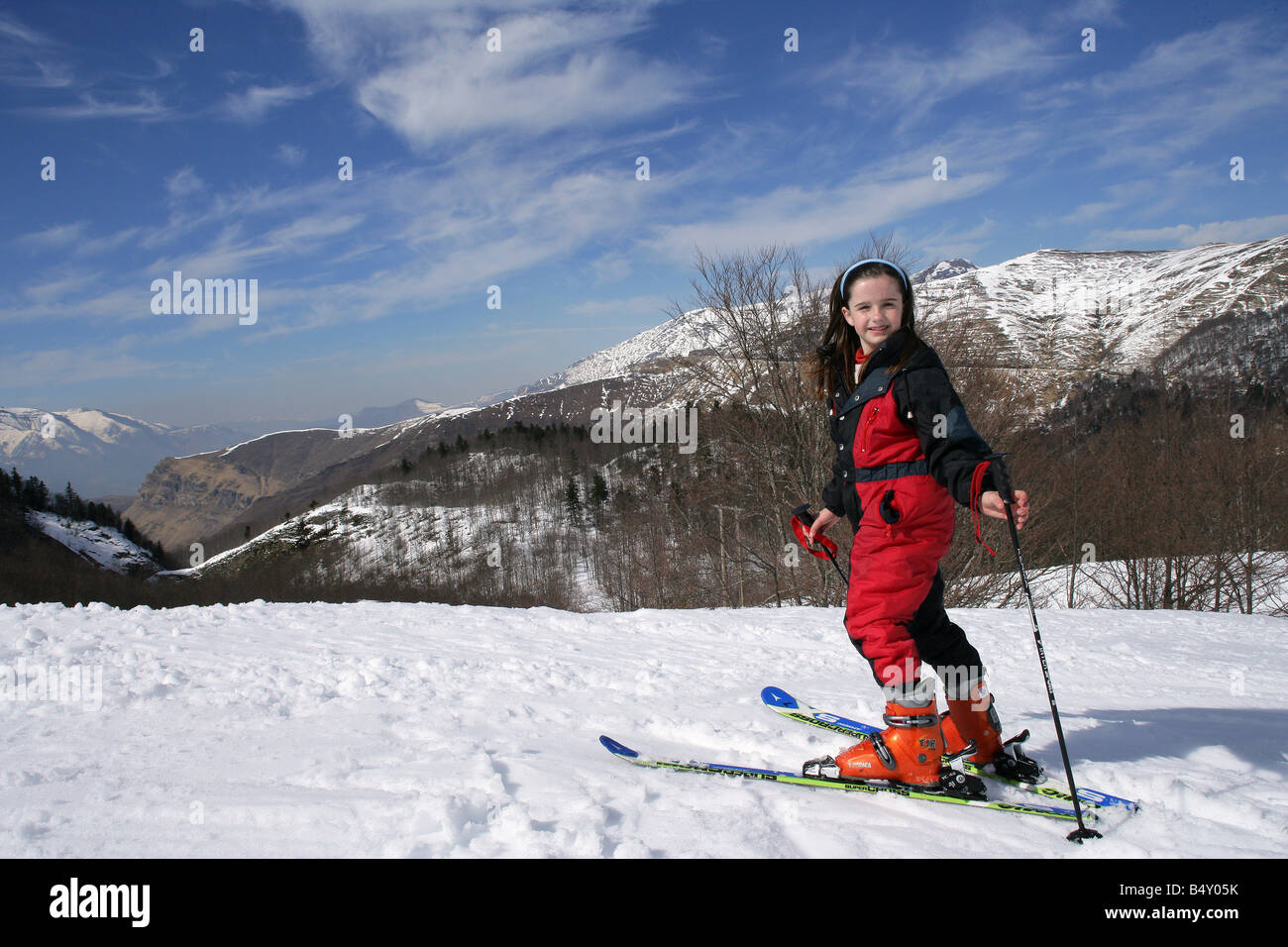 Girl skiing on snow, side view Stock Photo - Alamy
