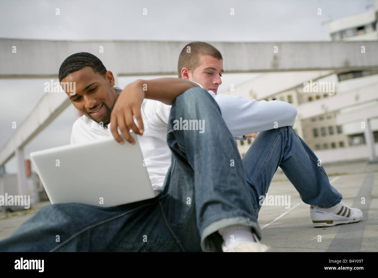 Young men with laptop Stock Photo - Alamy