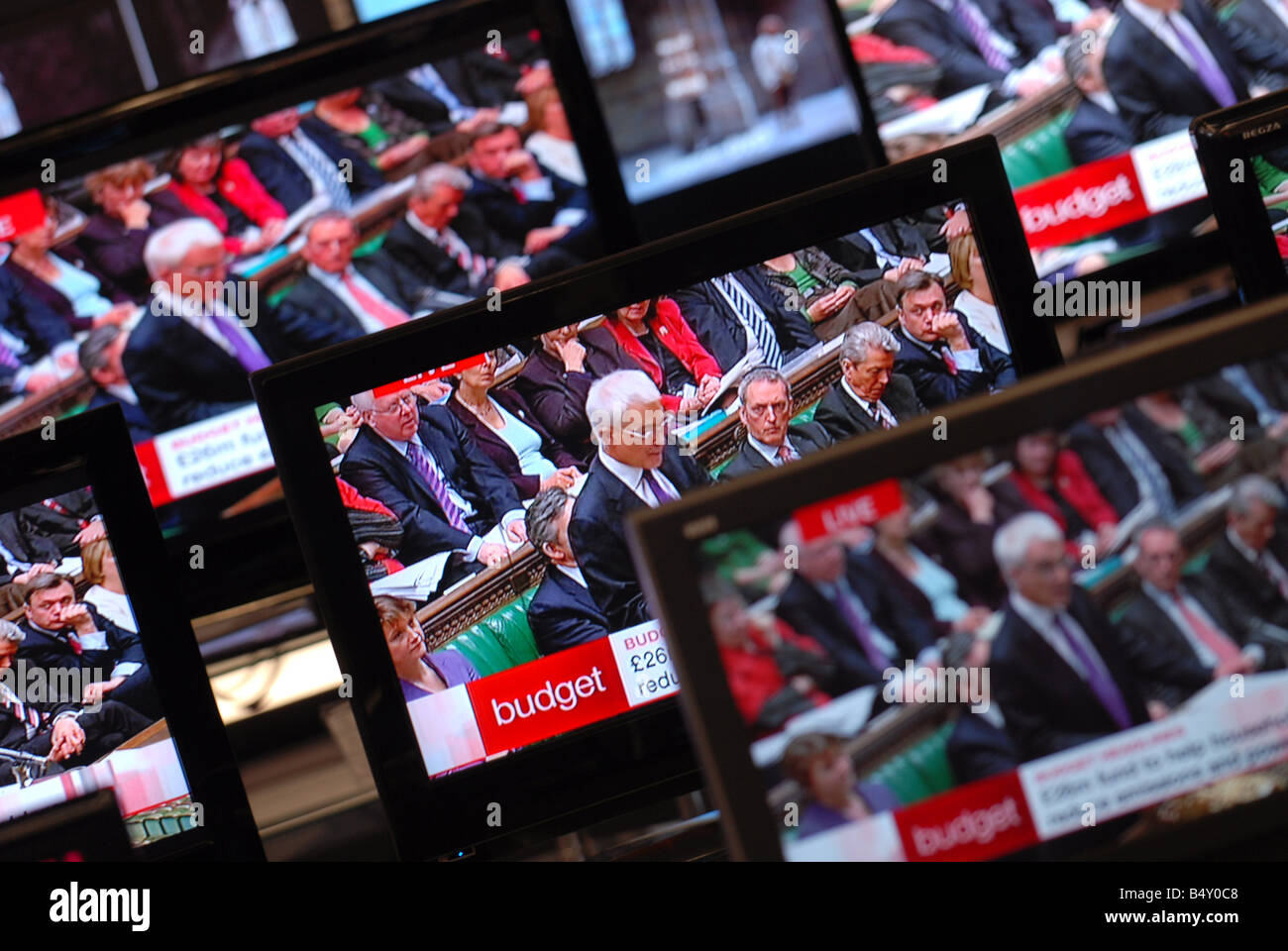 TV screens in a shop, showing the Budget Stock Photo - Alamy